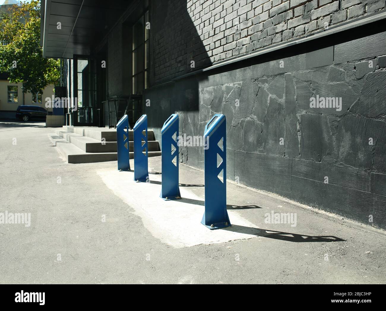 Metal public bike rack Stock Photo - Alamy