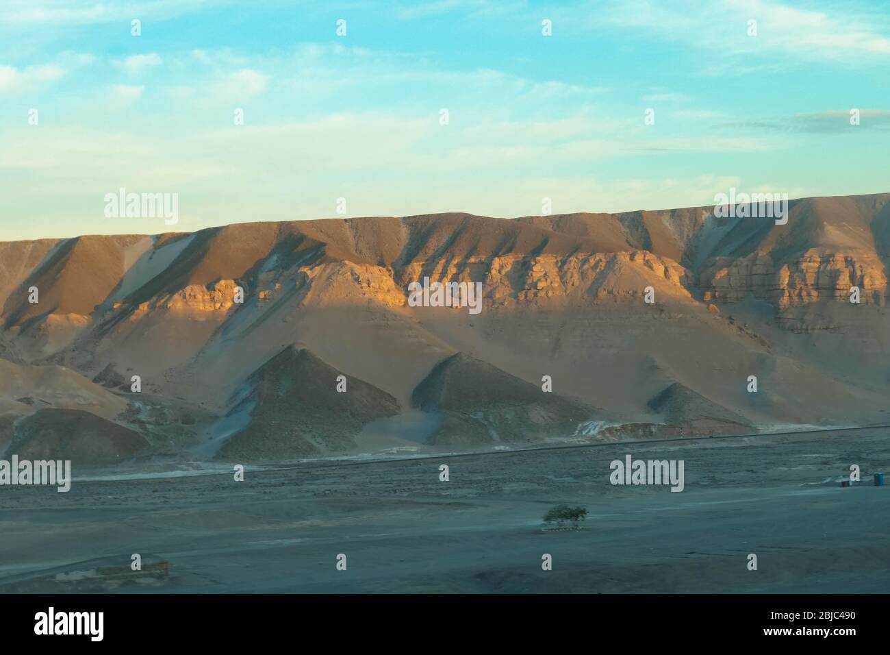 Sun light on mountain Peru Stock Photo - Alamy