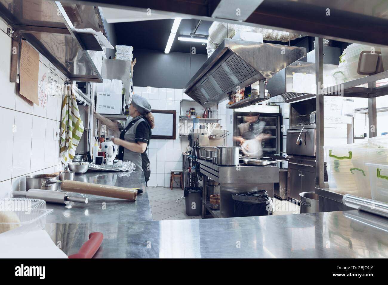 Behind the scenes of brands. The chef cooking in a professional kitchen ...