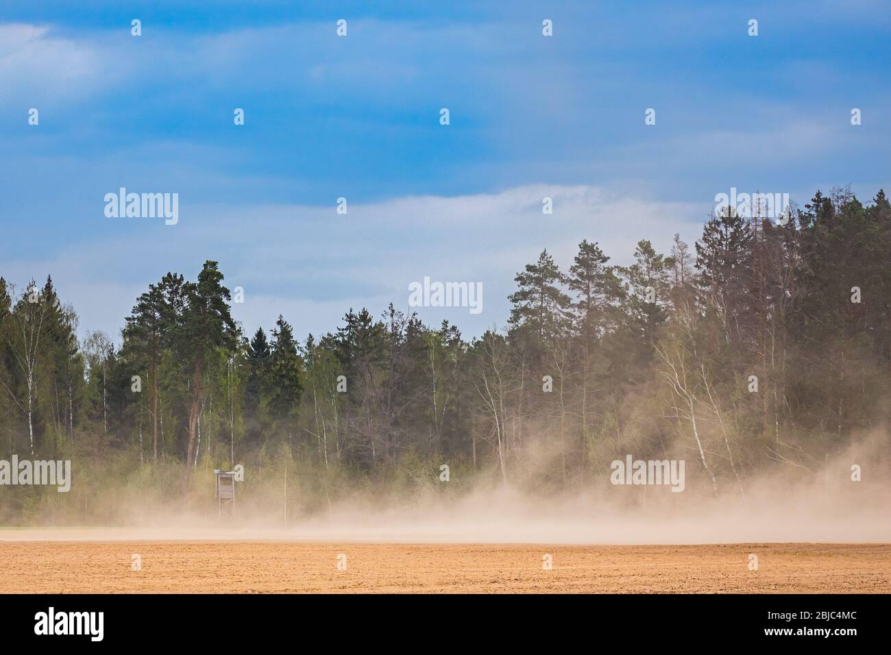 Dust storm in dry fields, dry weather infuenced by climate change Stock ...