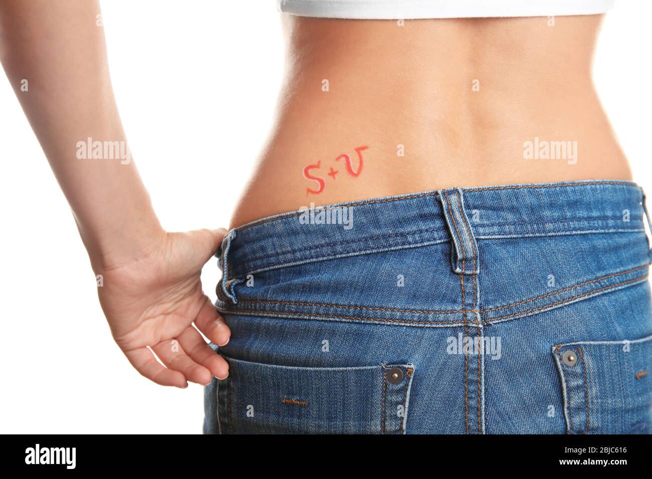 Temporary tattoo on woman back Stock Photo - Alamy