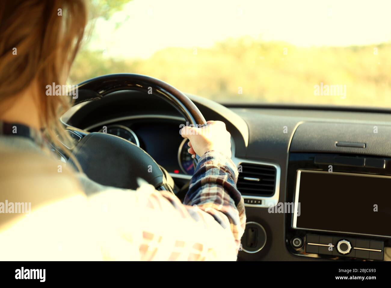 Young female driver in car on road trip Stock Photo - Alamy