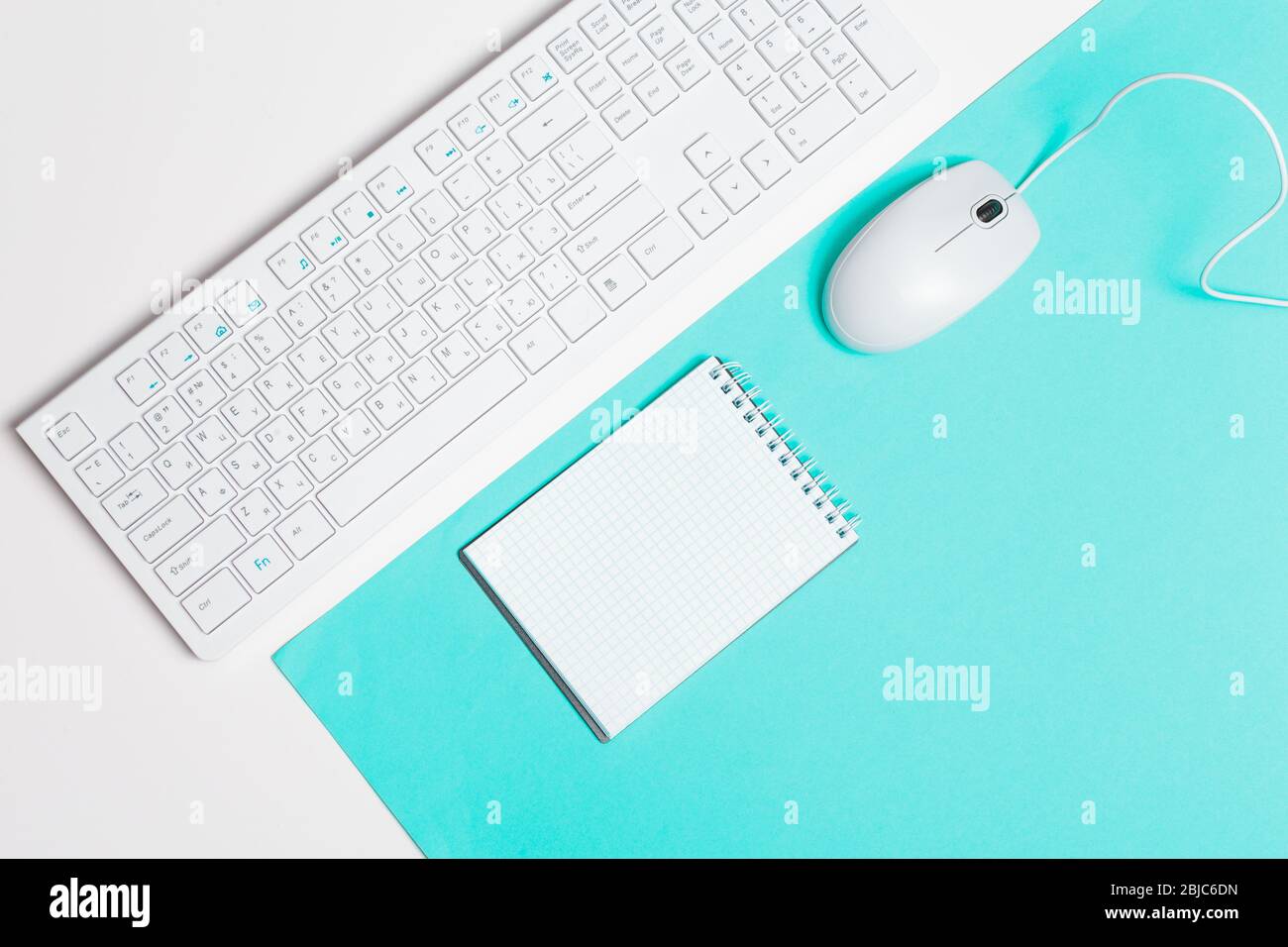 Computer keyboard and mouse on color block background, office interior ...