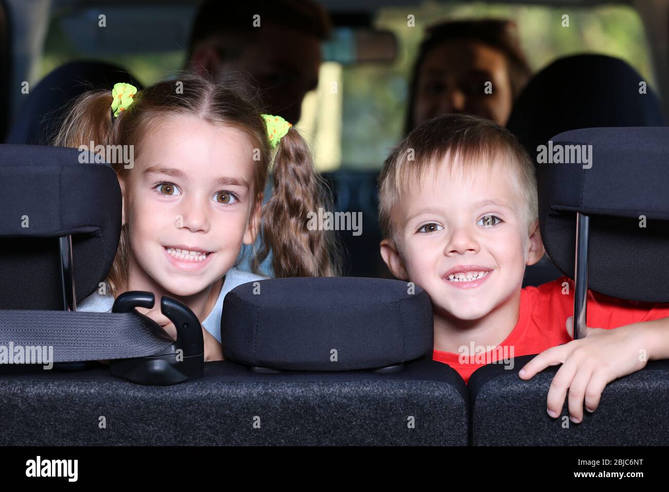 Children with their parents in car Stock Photo - Alamy