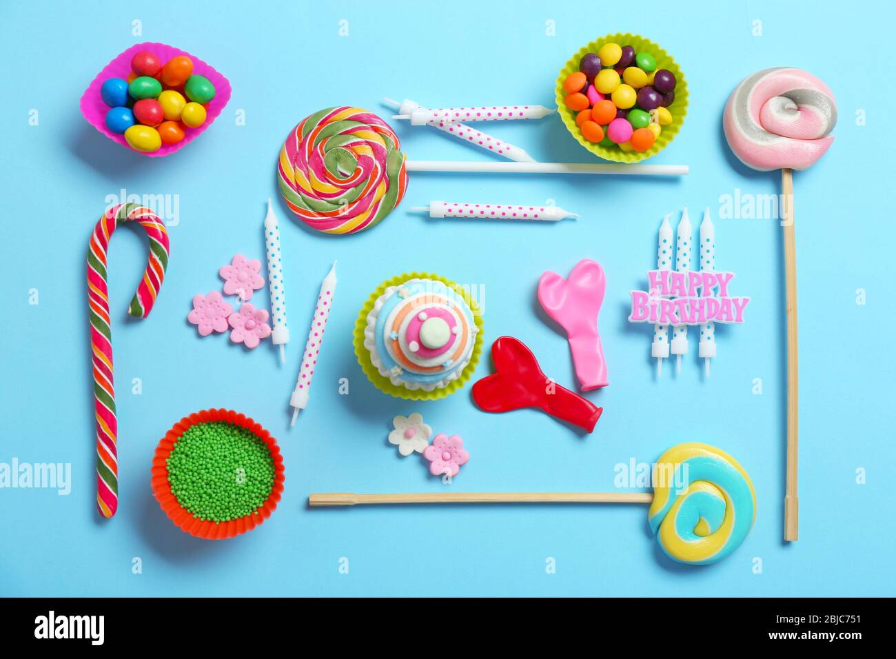 Bright birthday background with sweets and decorations Stock Photo - Alamy