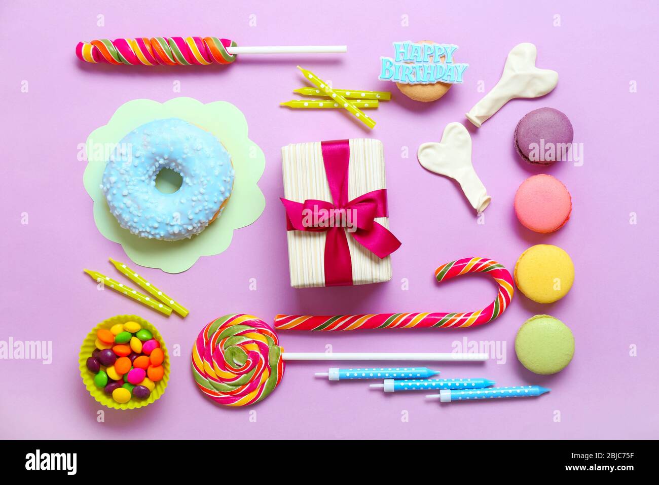 Bright birthday background with sweets and decorations Stock Photo - Alamy