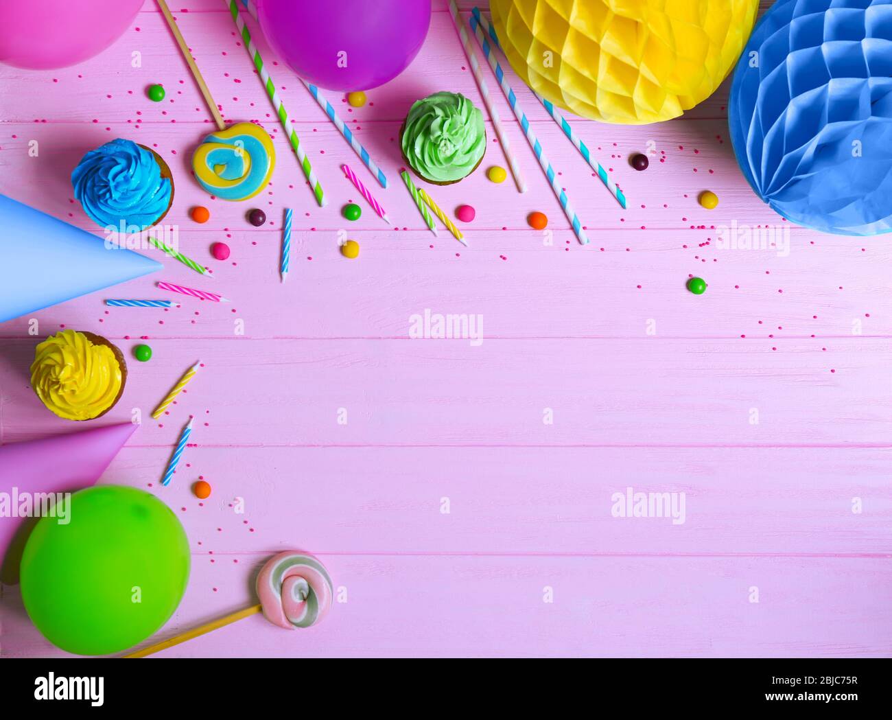 Bright birthday background with sweets and decorations Stock Photo - Alamy