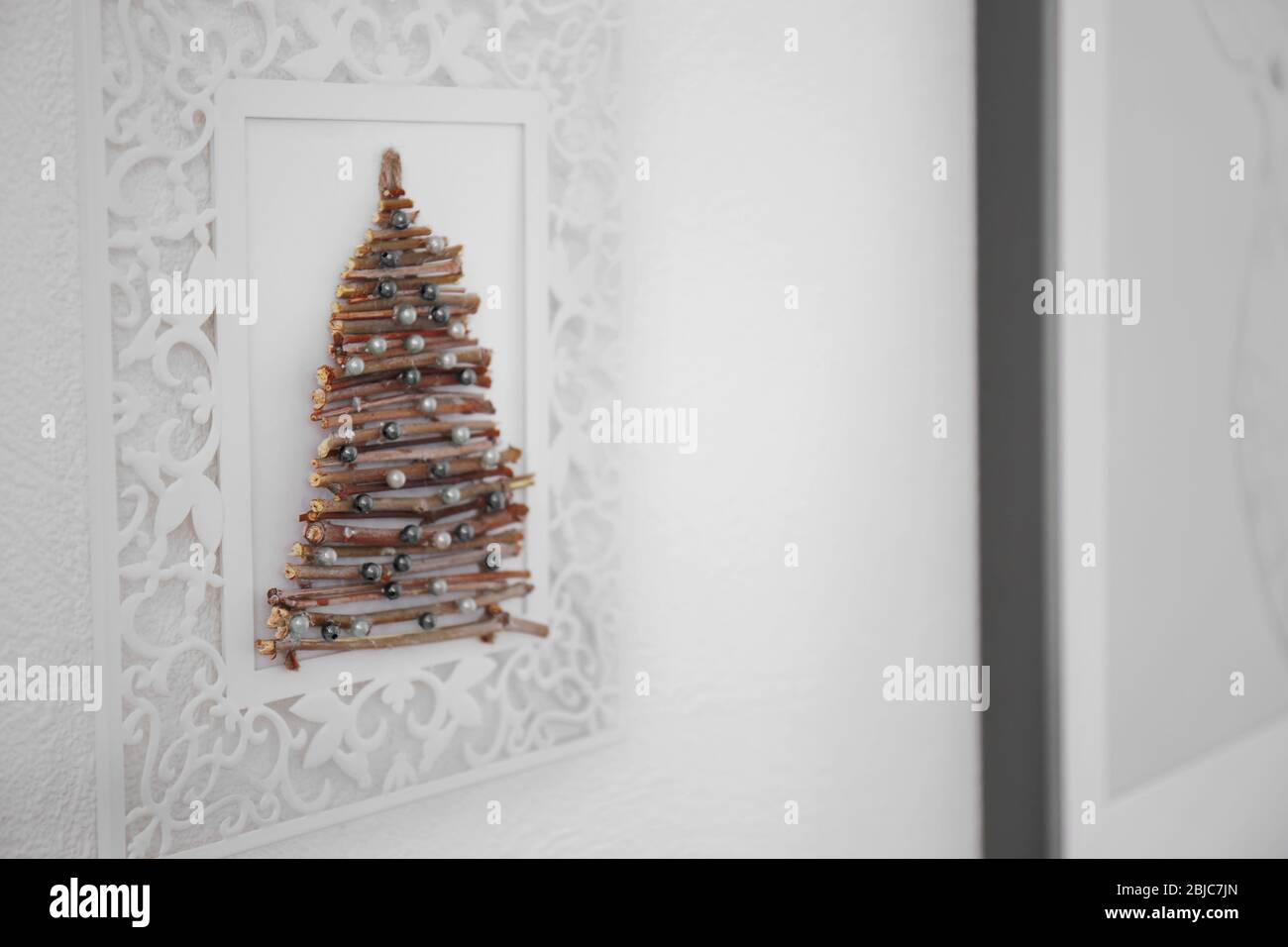 Handmade Christmas tree in photo frame on white wall Stock Photo - Alamy