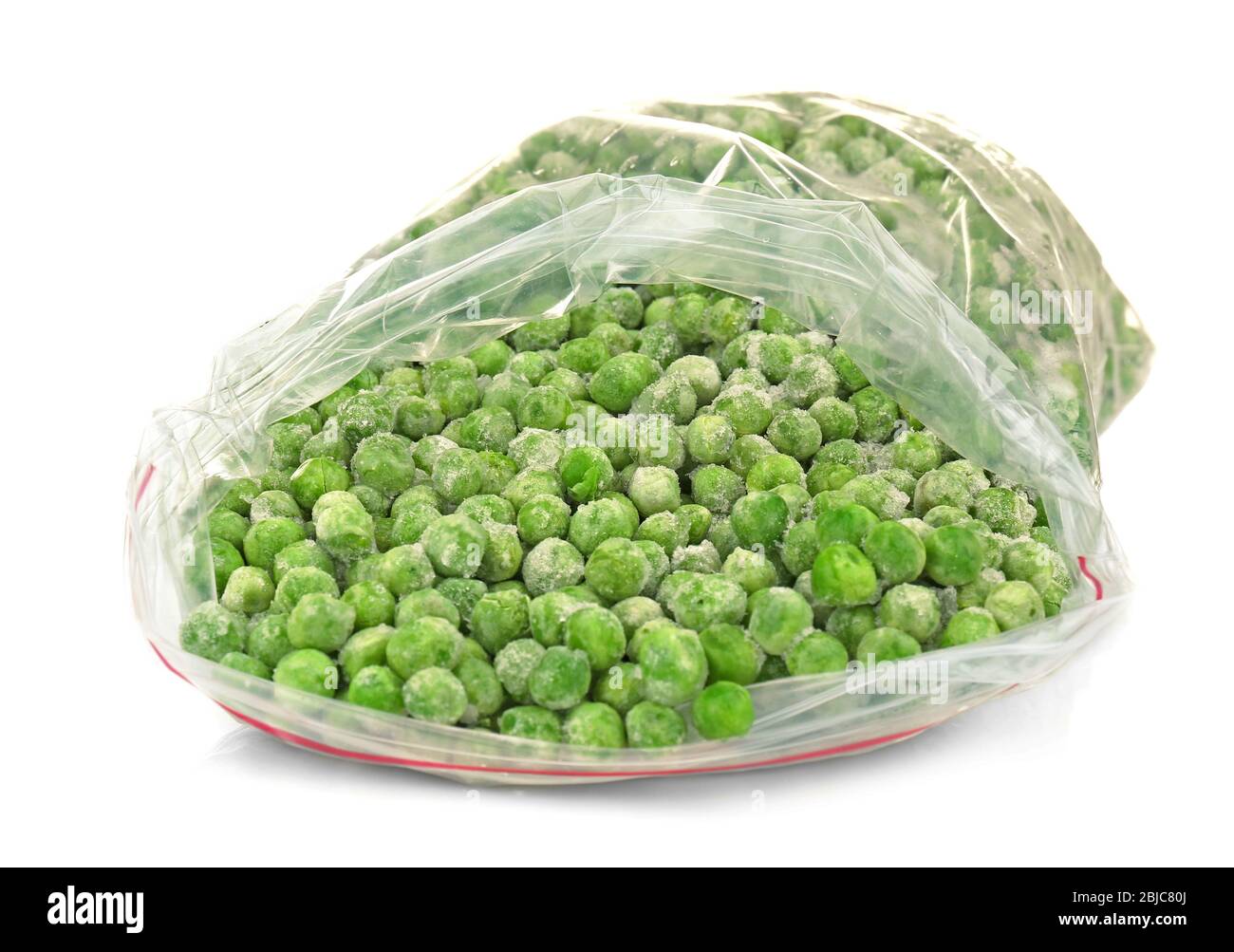 Frozen peas on white background Stock Photo - Alamy