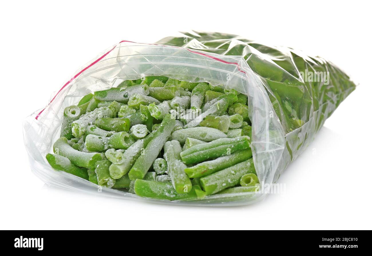 Frozen French beans on white background Stock Photo - Alamy