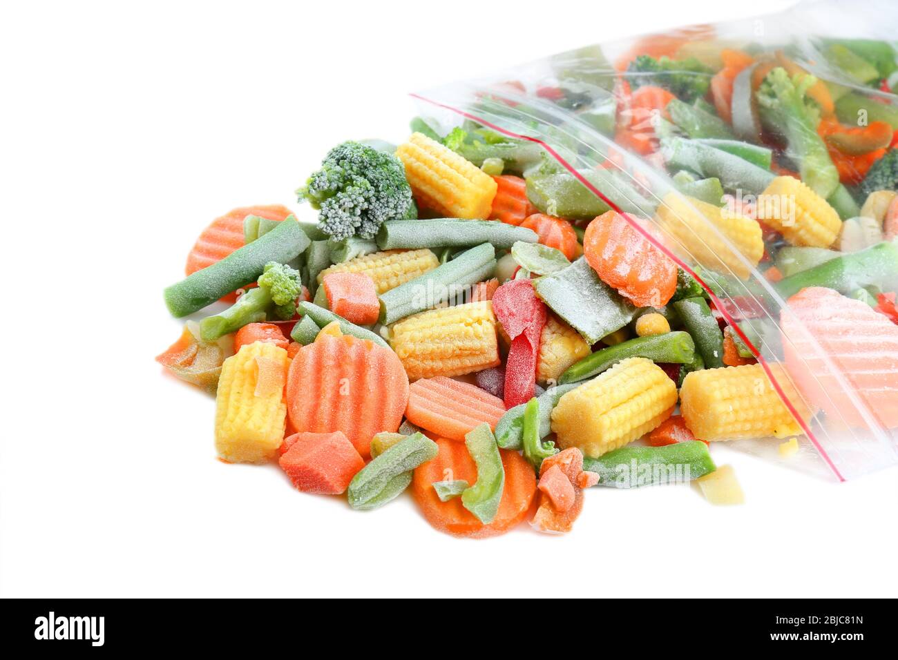 Frozen vegetable mix on white background Stock Photo - Alamy