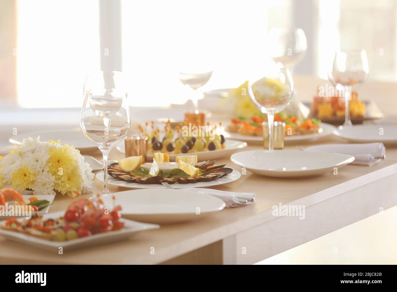 Table setting for holiday buffet, close up view Stock Photo - Alamy