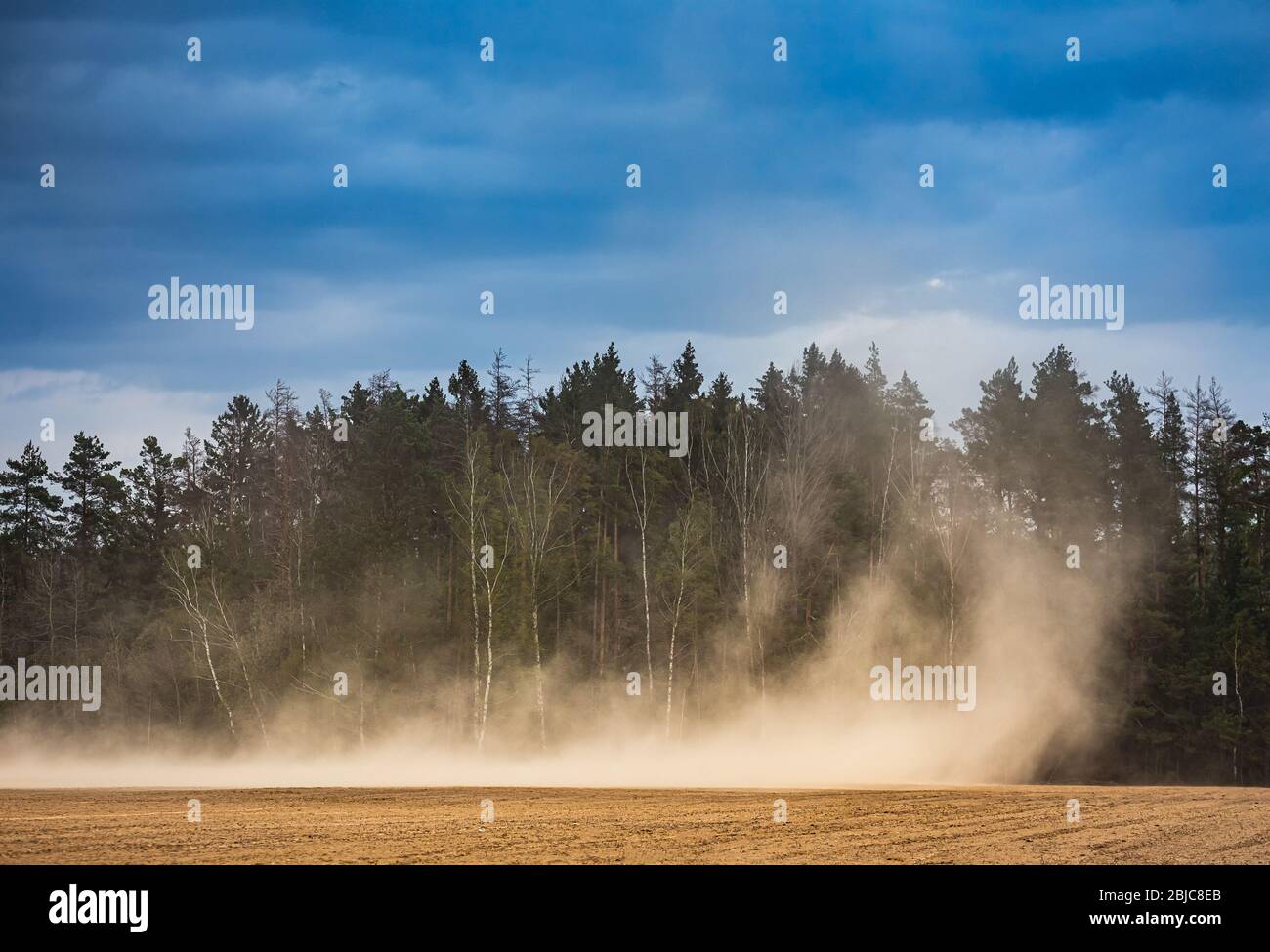 Dust storm in dry fields, dry weather infuenced by climate change Stock ...