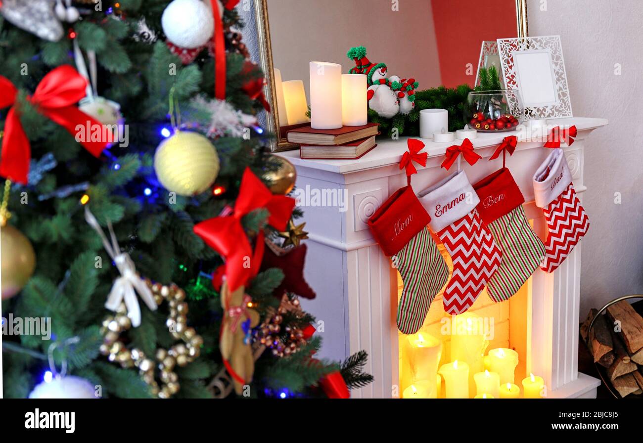 Beautiful fireplace with stockings decorated for Christmas Stock Photo ...