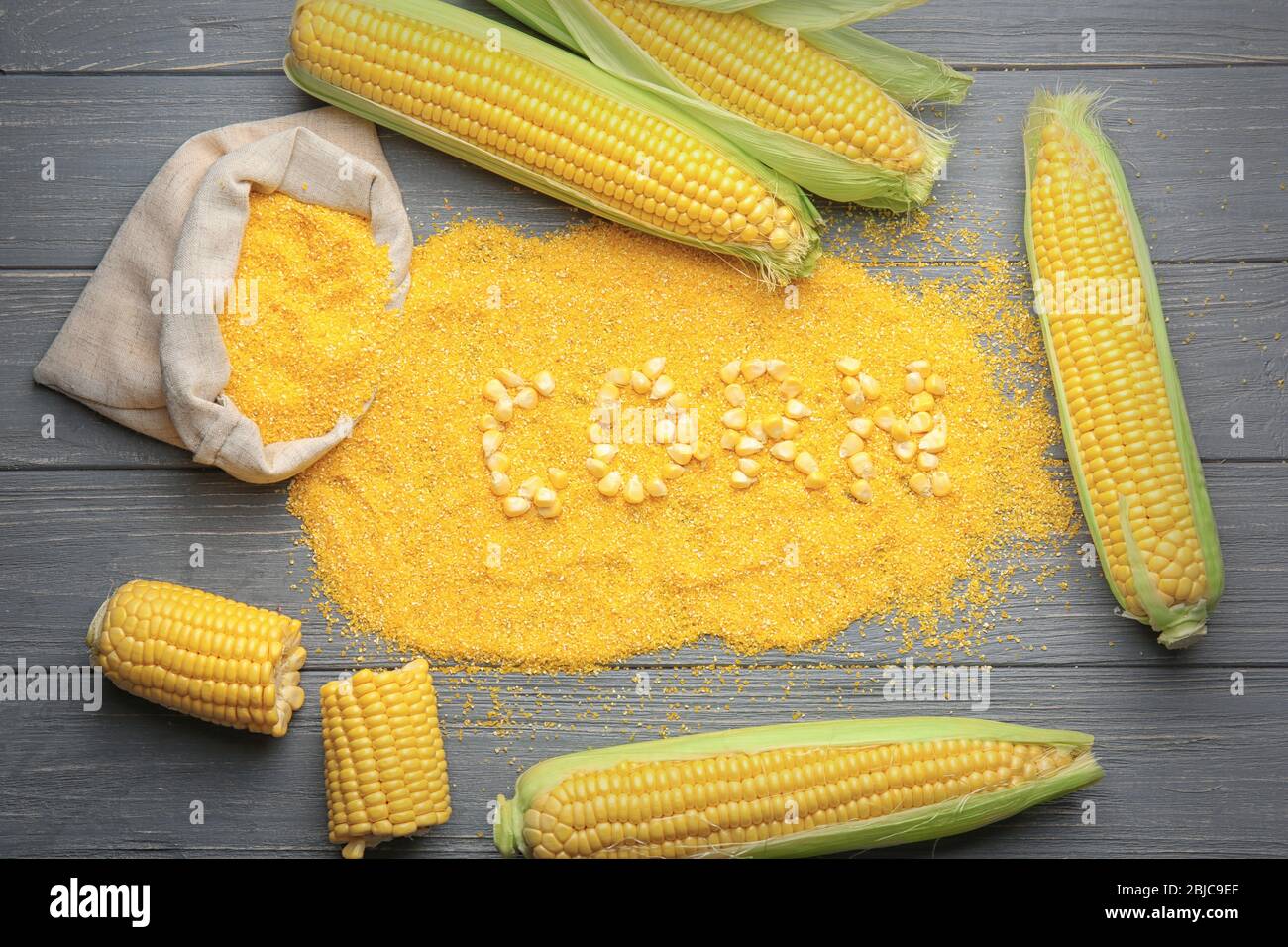 Word CORN made of grains on cornflour background Stock Photo - Alamy
