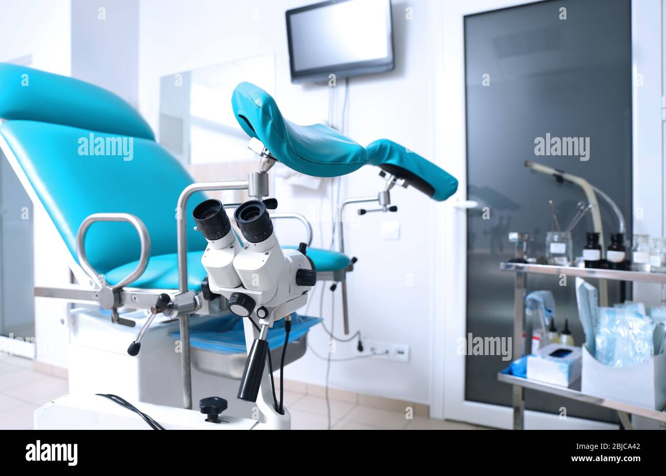 Gynecological room with chair and equipment Stock Photo - Alamy