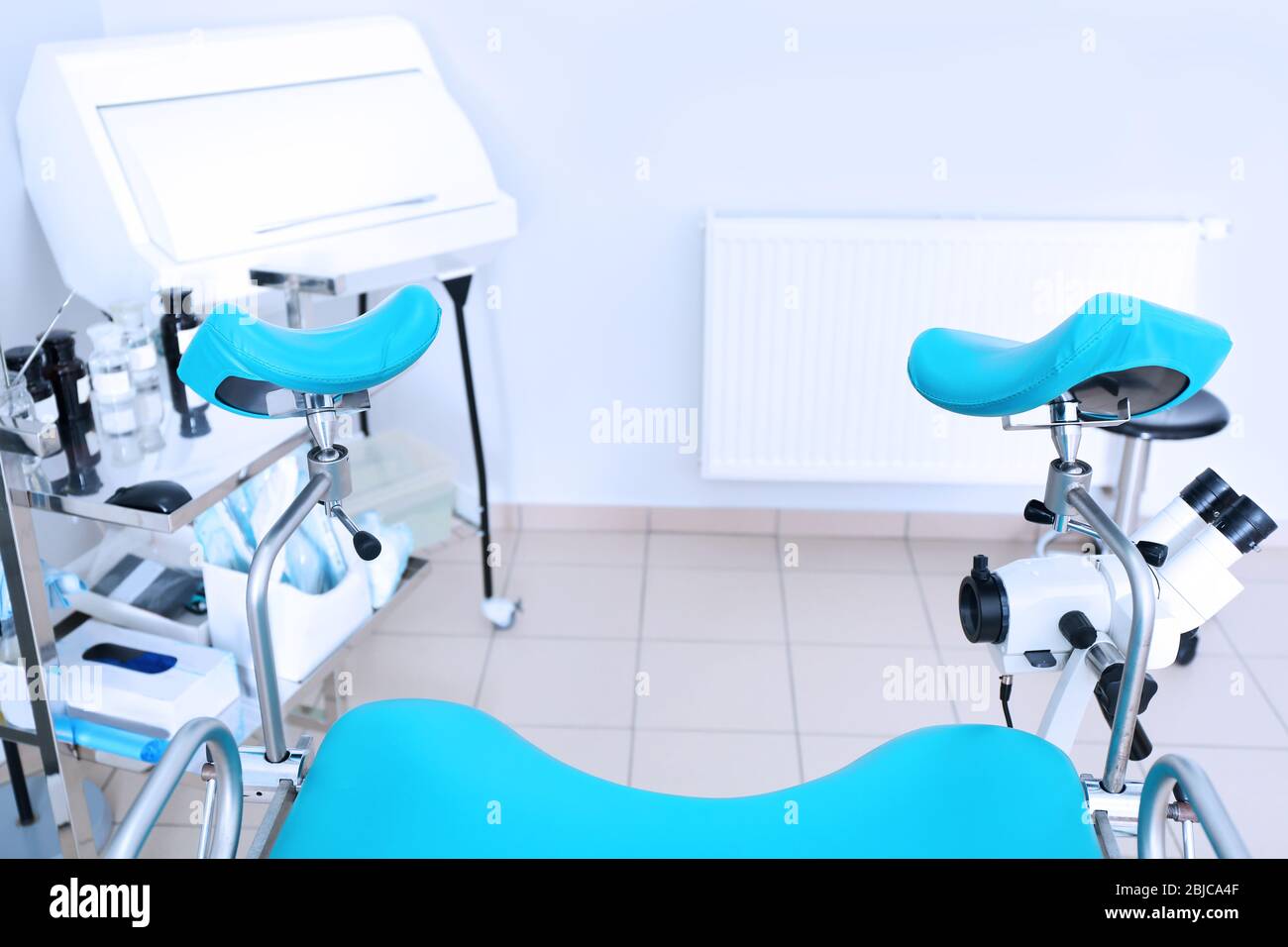 Gynecological room with chair and equipment Stock Photo - Alamy