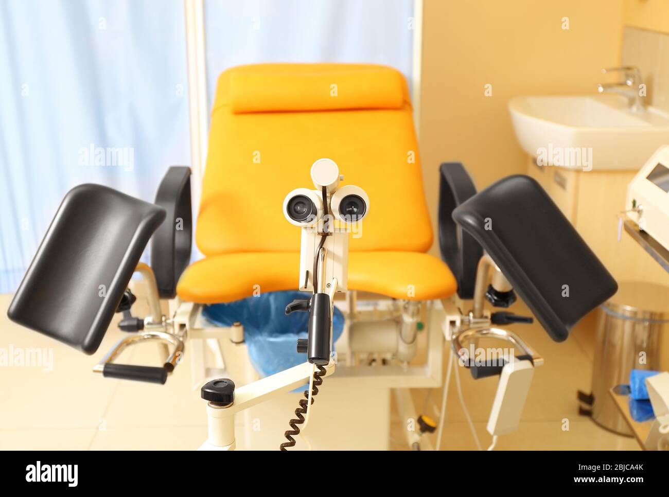 Gynecological room with chair and equipment Stock Photo - Alamy