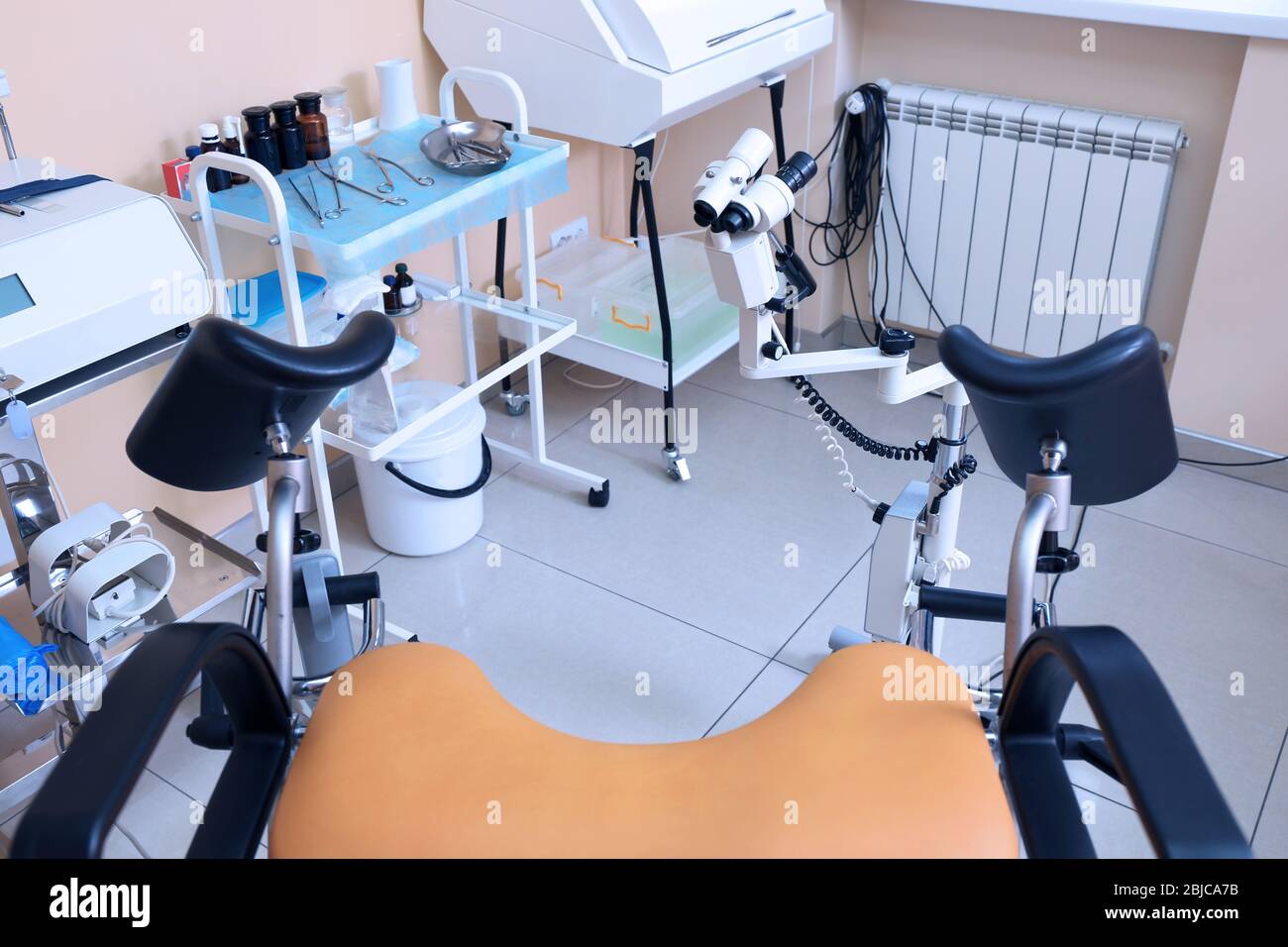 Gynecological room with chair and equipment Stock Photo - Alamy