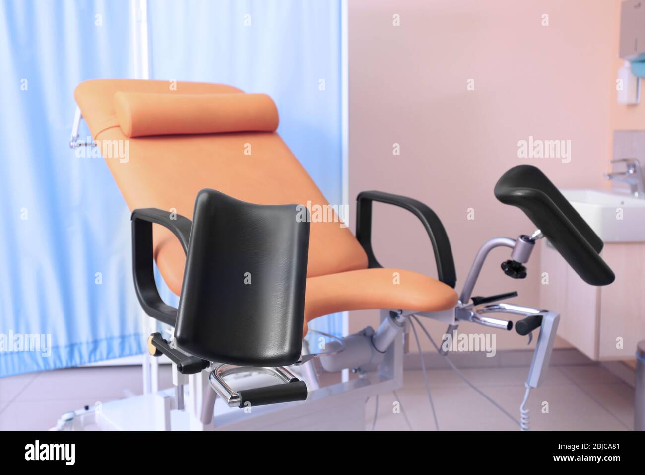 Gynecological room with chair and equipment Stock Photo - Alamy