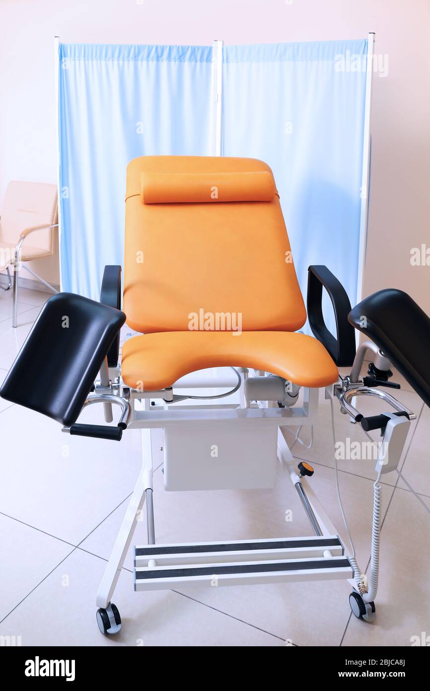 Gynecological room with chair and equipment Stock Photo - Alamy
