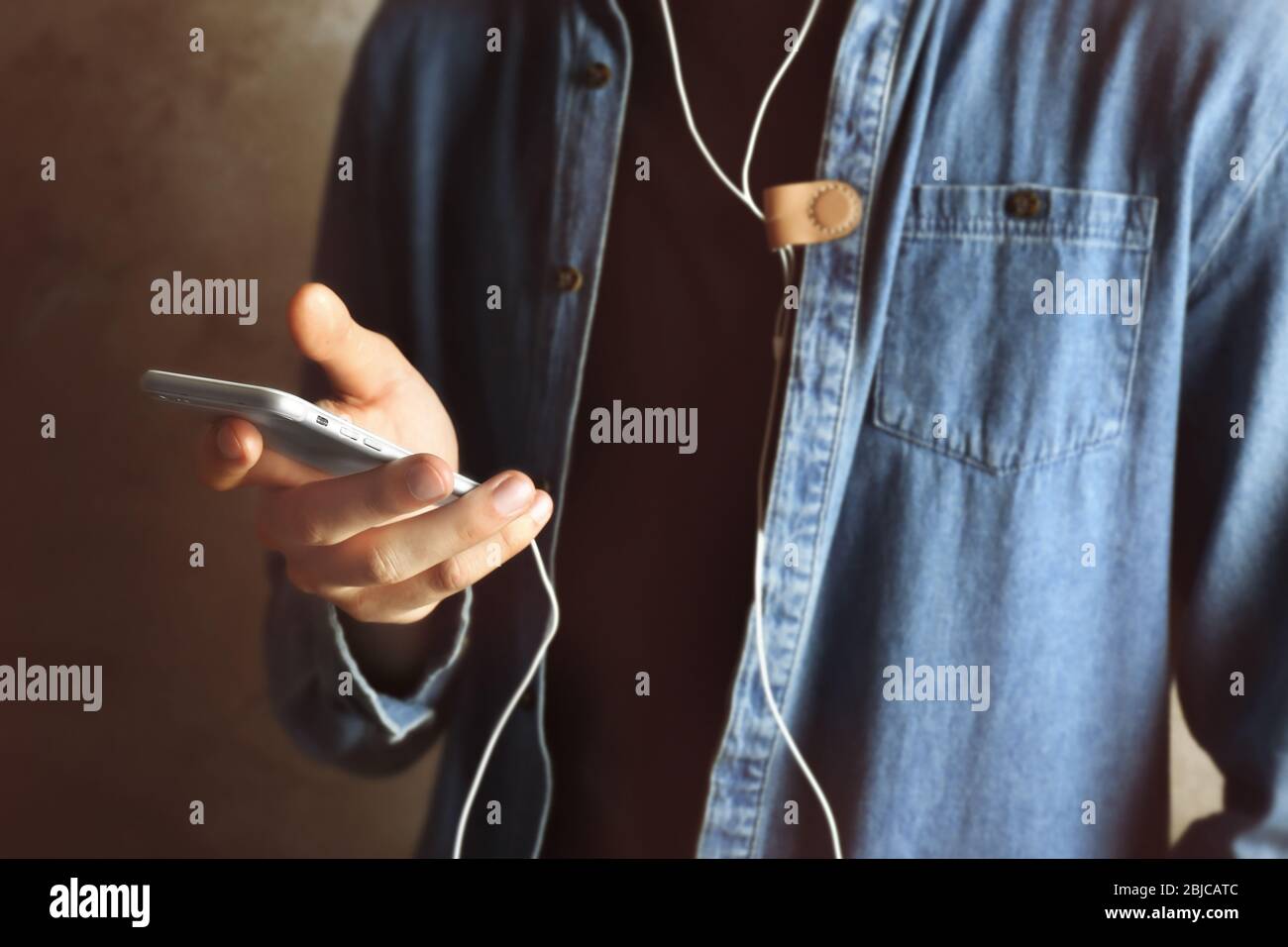 Usage example of multifunctional magnetic clip as earphones cable ...