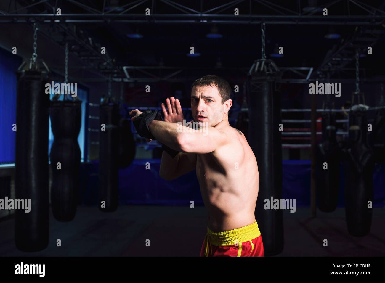 Man boxer in sportswear trains hi-res stock photography and images - Alamy
