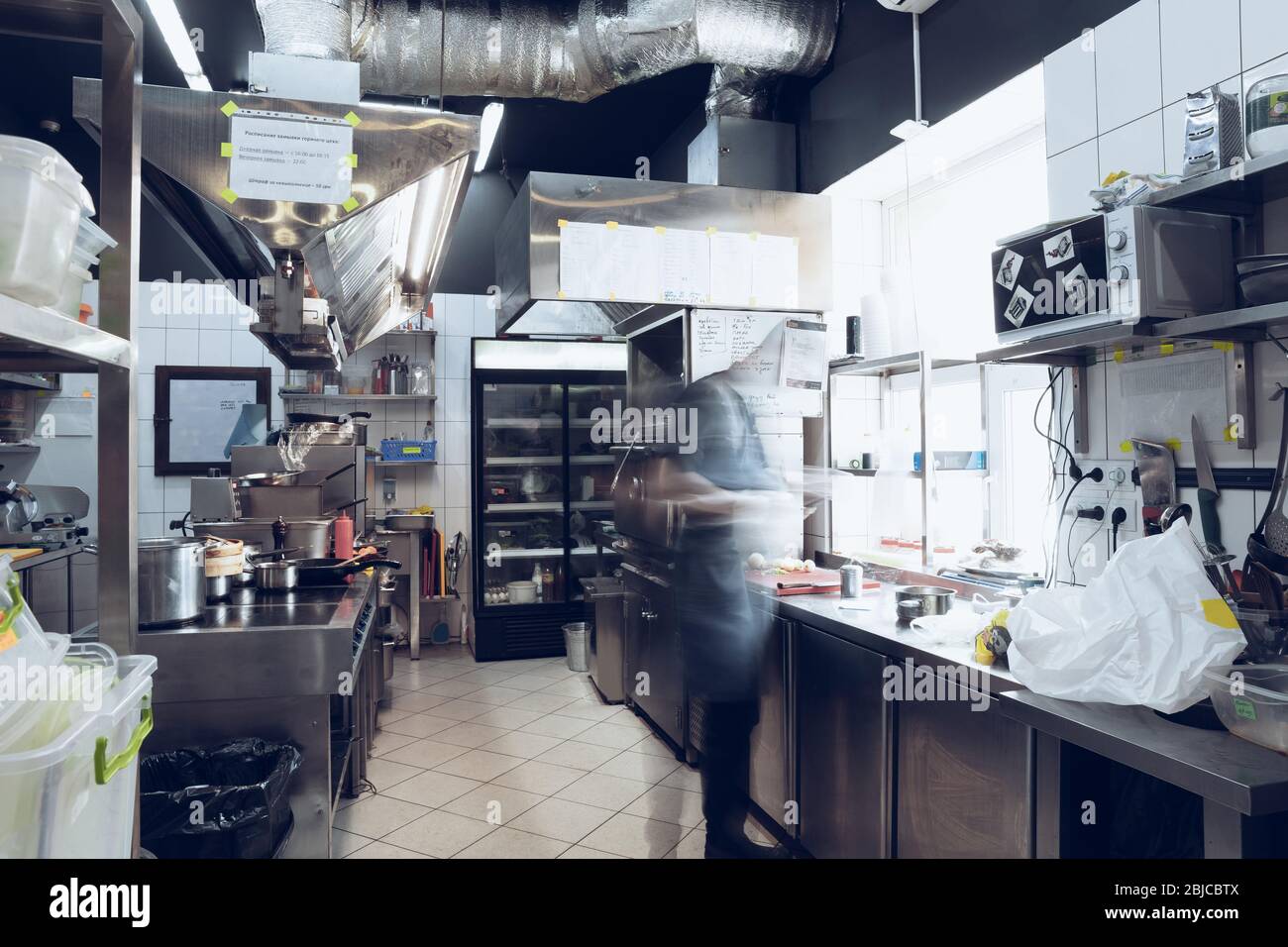 Behind the scenes of brands. The chef cooking in a professional kitchen ...