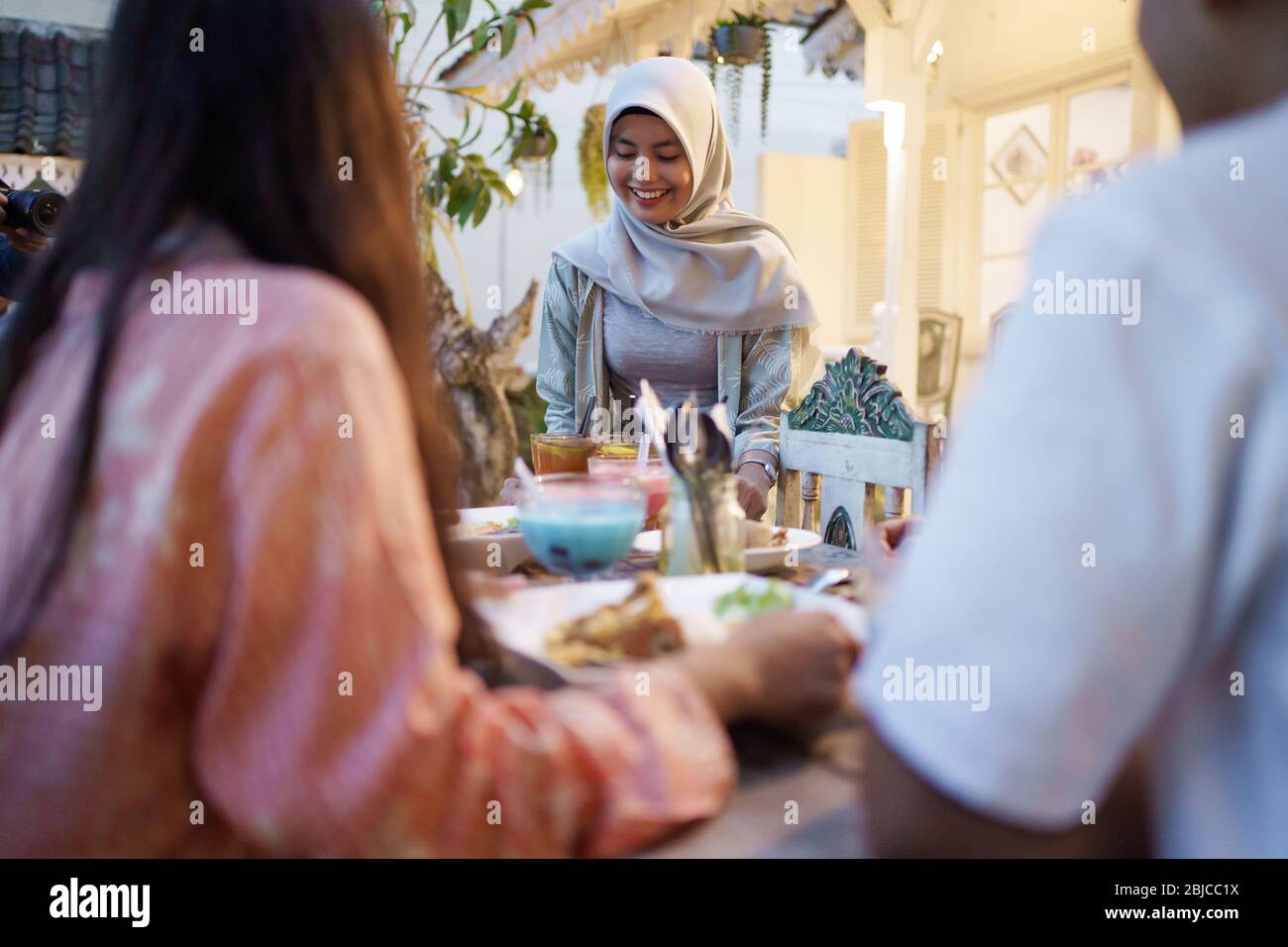 beautiful muslim woman preparing dining table for breaking the fast ...
