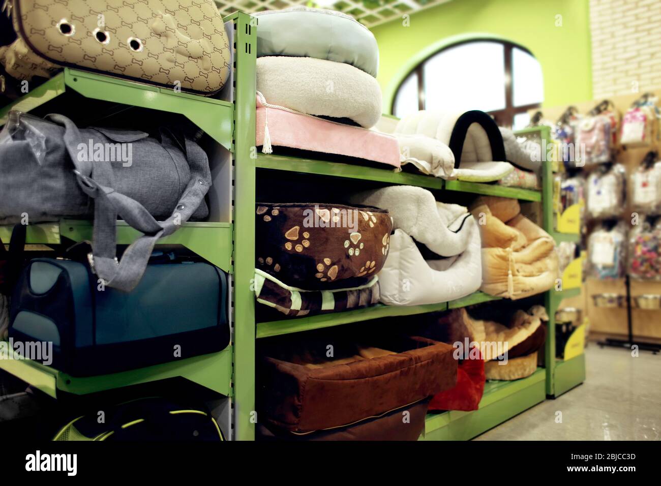 Different animal goods on pet shop shelves Stock Photo - Alamy