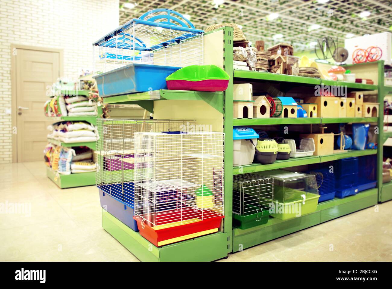Different animal goods on pet shop shelves Stock Photo - Alamy