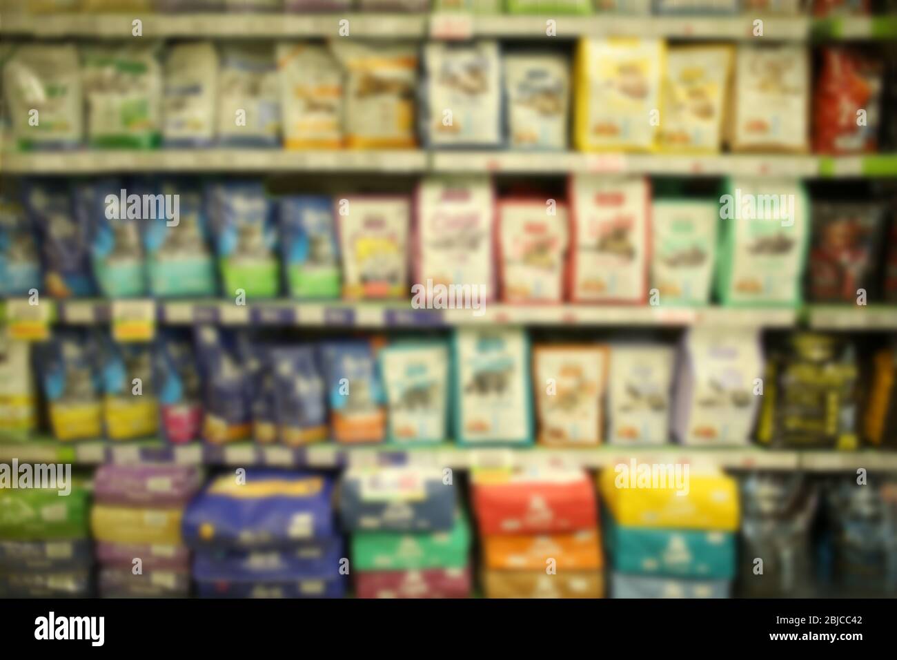 Packs of animal food on pet shop shelves Stock Photo - Alamy