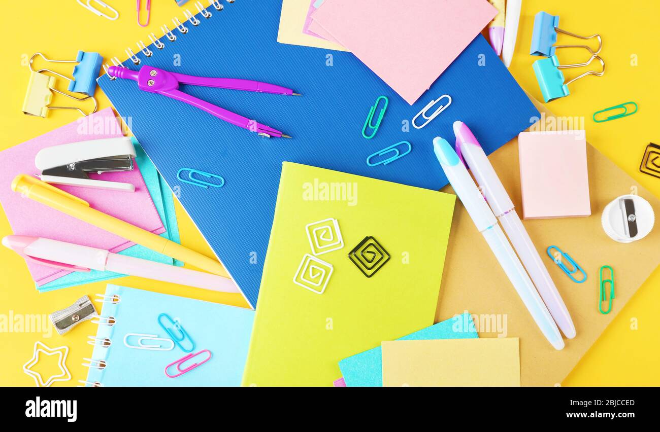 Colorful stationery on yellow background Stock Photo - Alamy