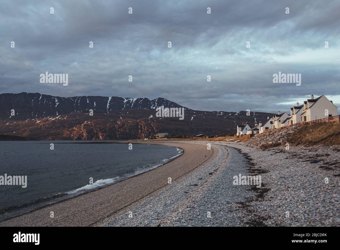 Holiday homes at the Ardmair village on Loch Kanaird. Ardmair is a ...