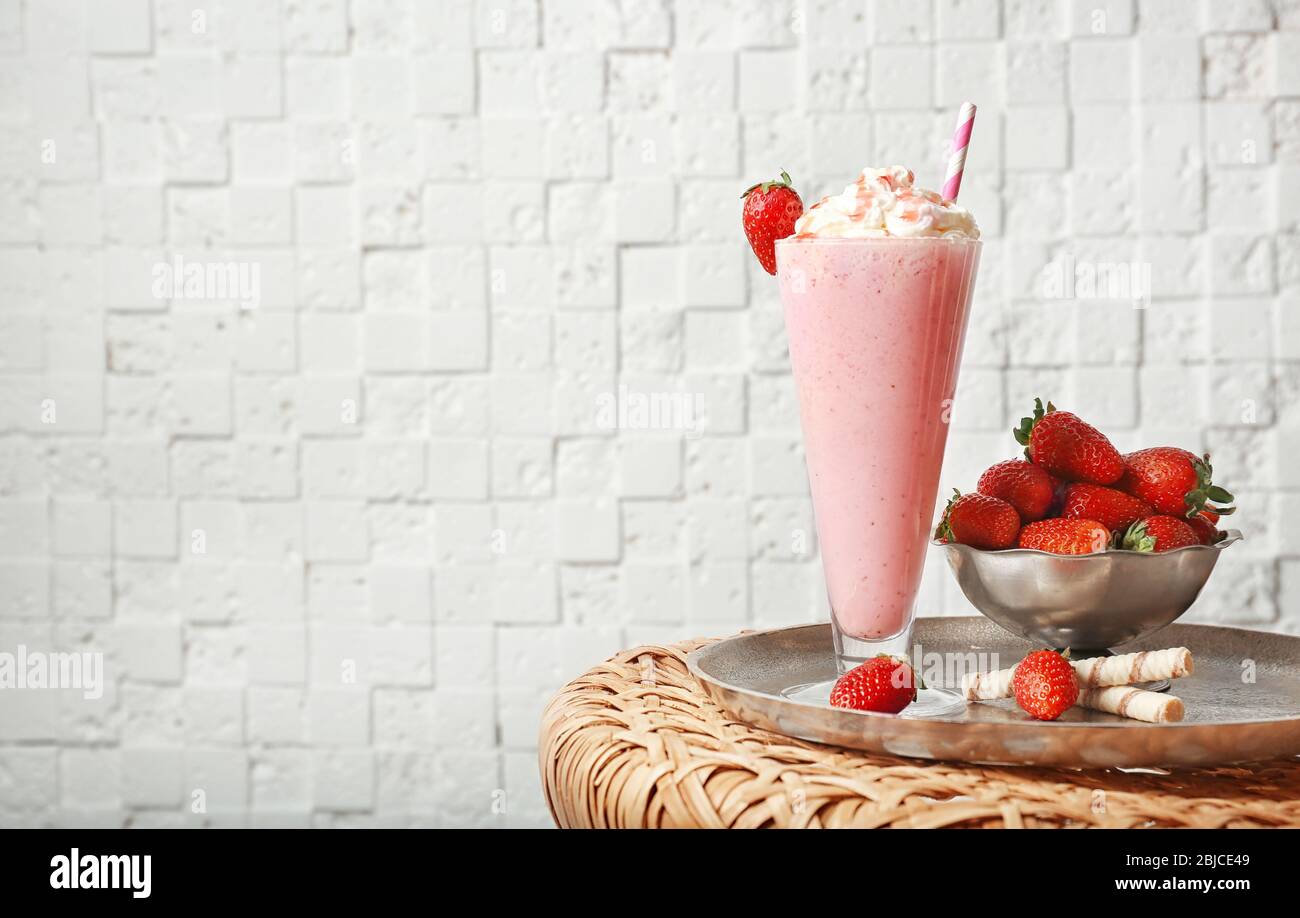 Delicious milkshake on white wall background Stock Photo - Alamy