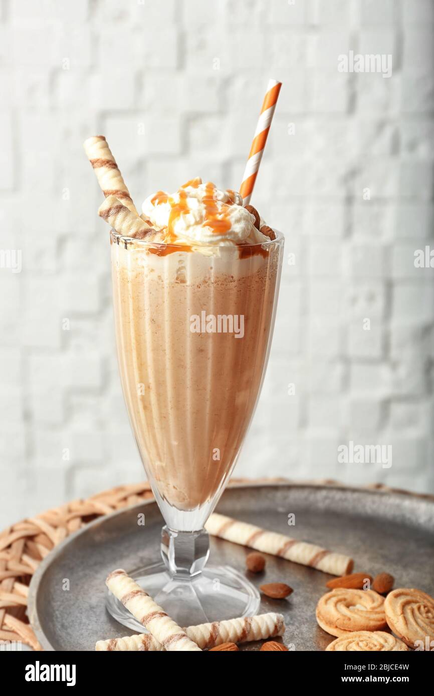 Delicious milkshake on white wall background Stock Photo - Alamy