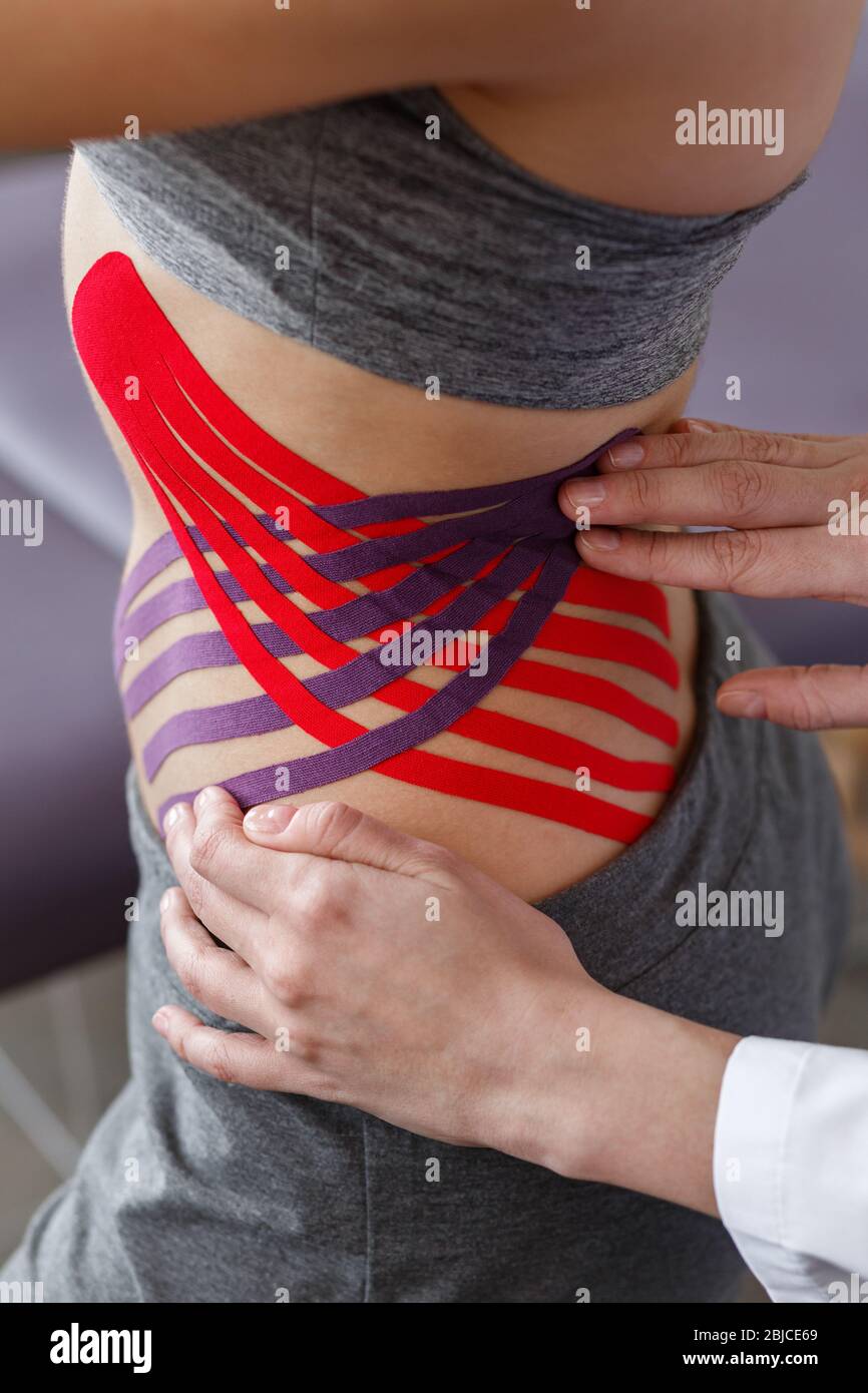 Weight loss concept.Kinesiology taping.Therapist applying kinesiology ...