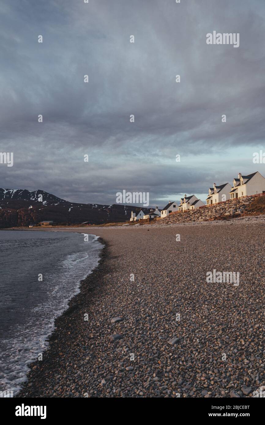 Holiday homes at the Ardmair village on Loch Kanaird. Ardmair is a ...
