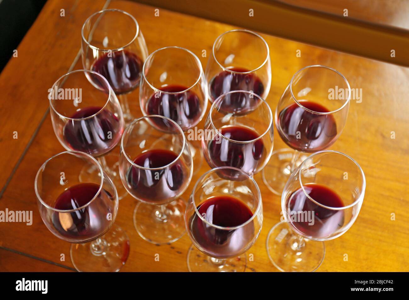 Glasses of red wine on bar counter Stock Photo - Alamy
