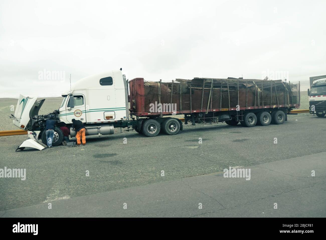 Lorry broken down with large load Peru repairing mend carpark engine ...