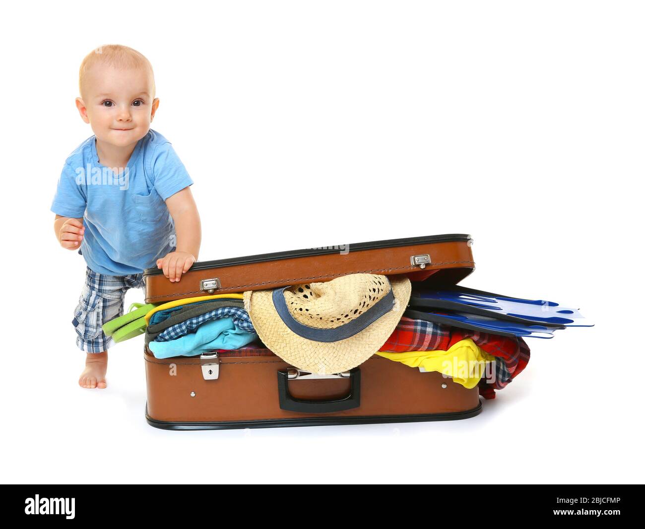 Baby with suitcase on white background Stock Photo - Alamy