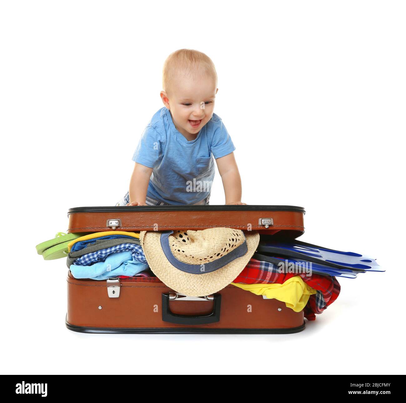 Baby with suitcase on white background Stock Photo - Alamy