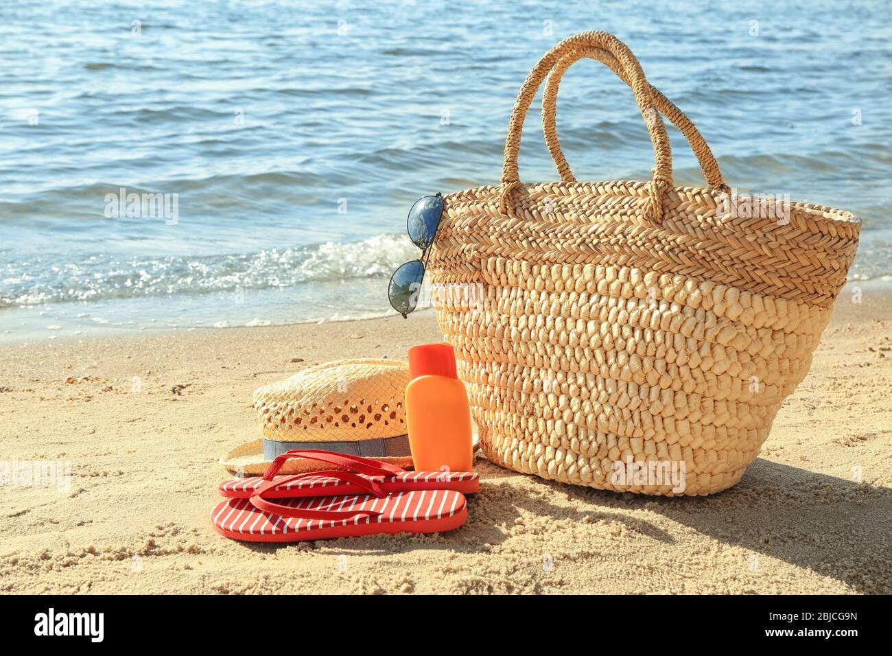 Sun protection set on the beach Stock Photo - Alamy