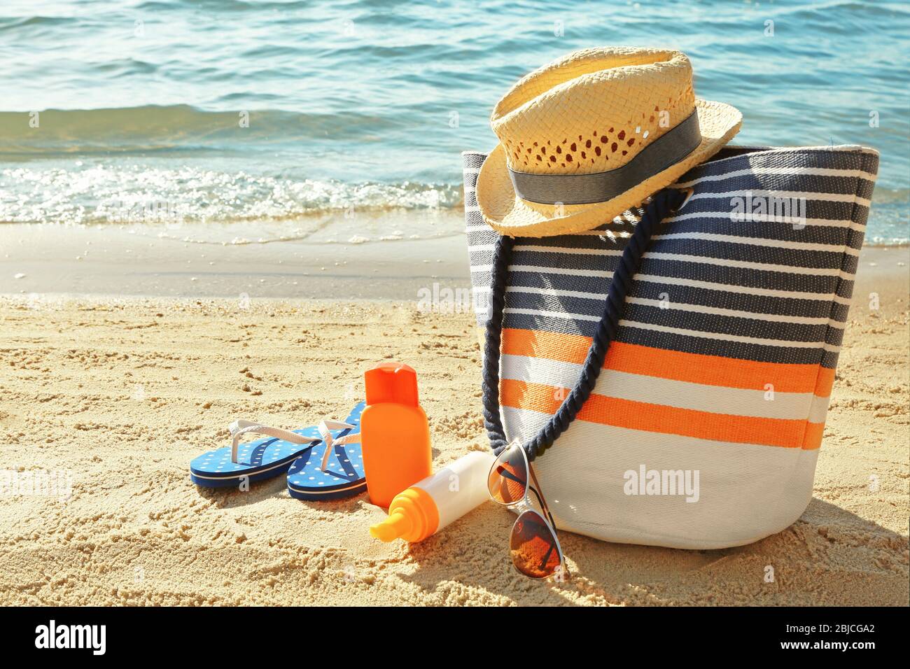 Sun protection set on the beach Stock Photo - Alamy