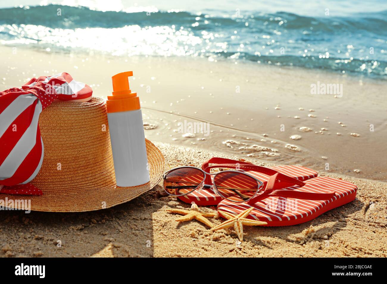 Sun protection set on the beach Stock Photo - Alamy