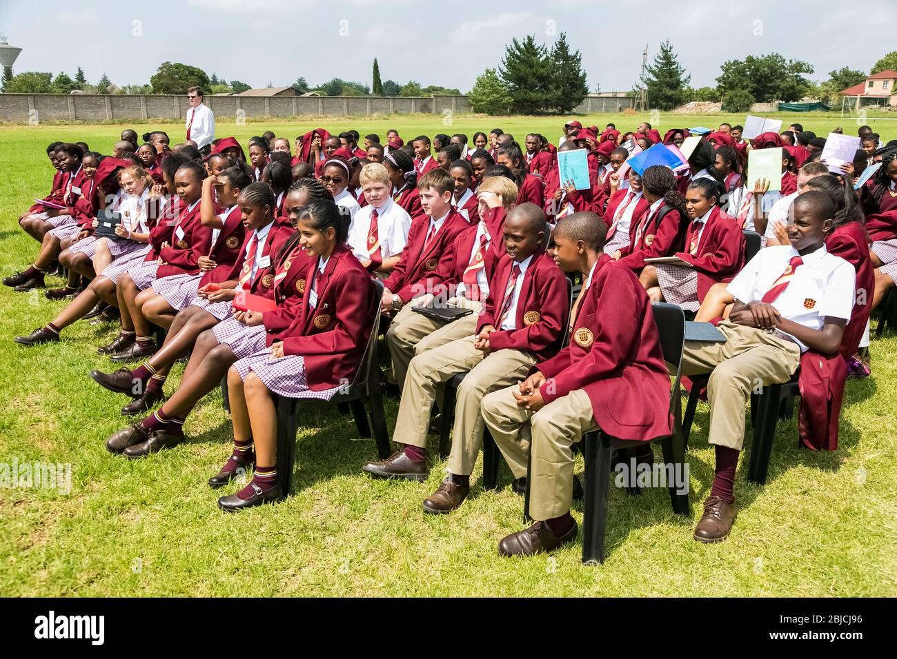 Children school assembly sitting hi-res stock photography and images ...