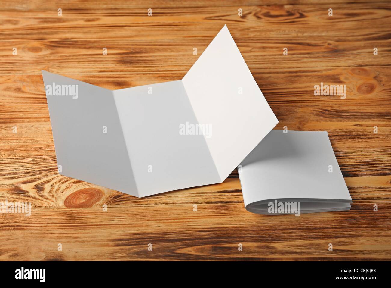 Blank brochure and booklet on wooden background Stock Photo - Alamy