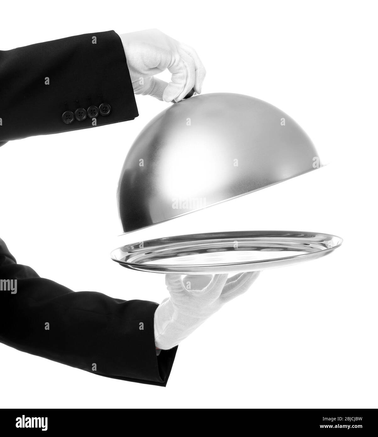 Waiter hands with cloche and tray on white background Stock Photo - Alamy
