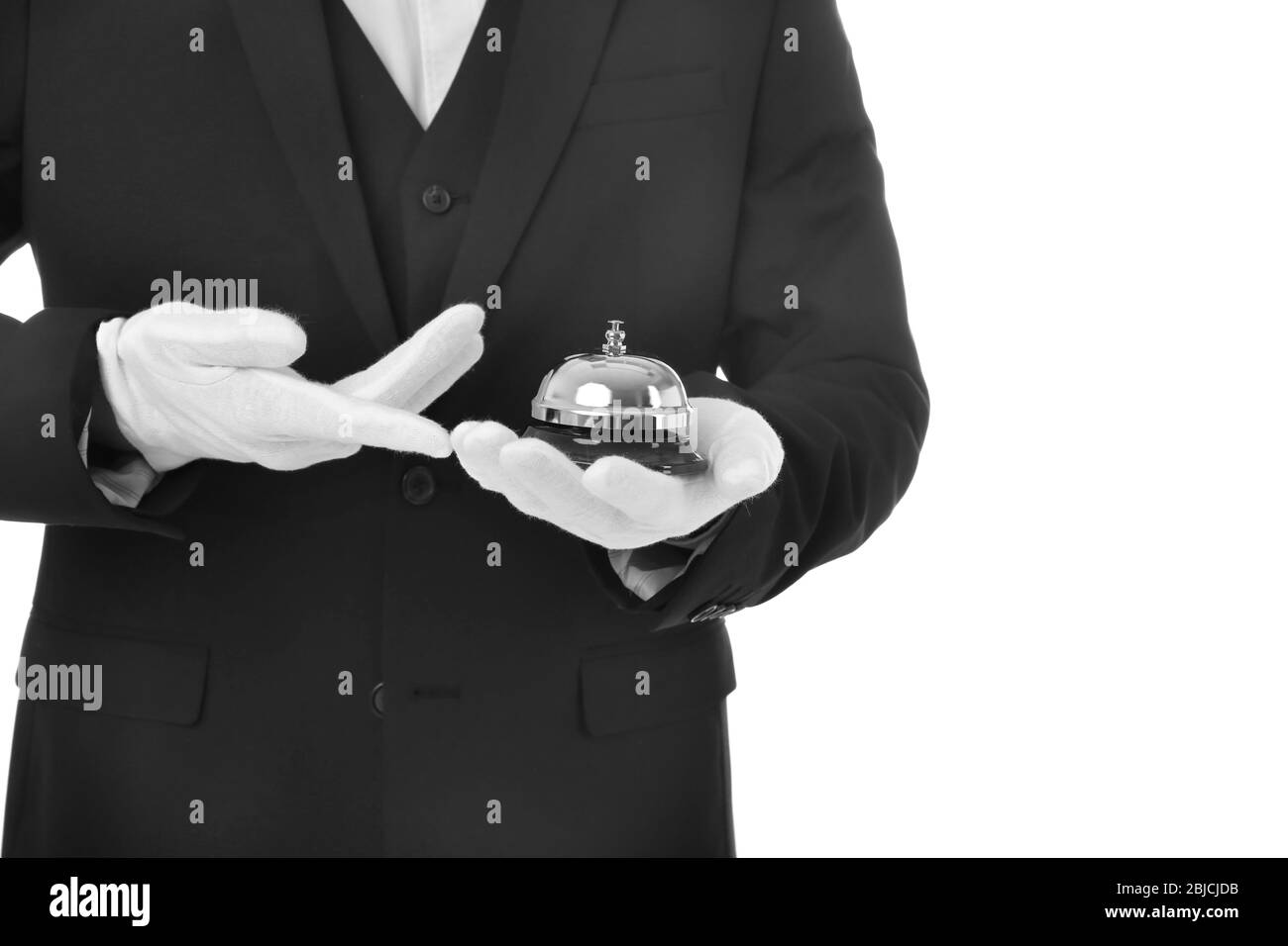 Man in suit with service bell on white background, closeup Stock Photo ...