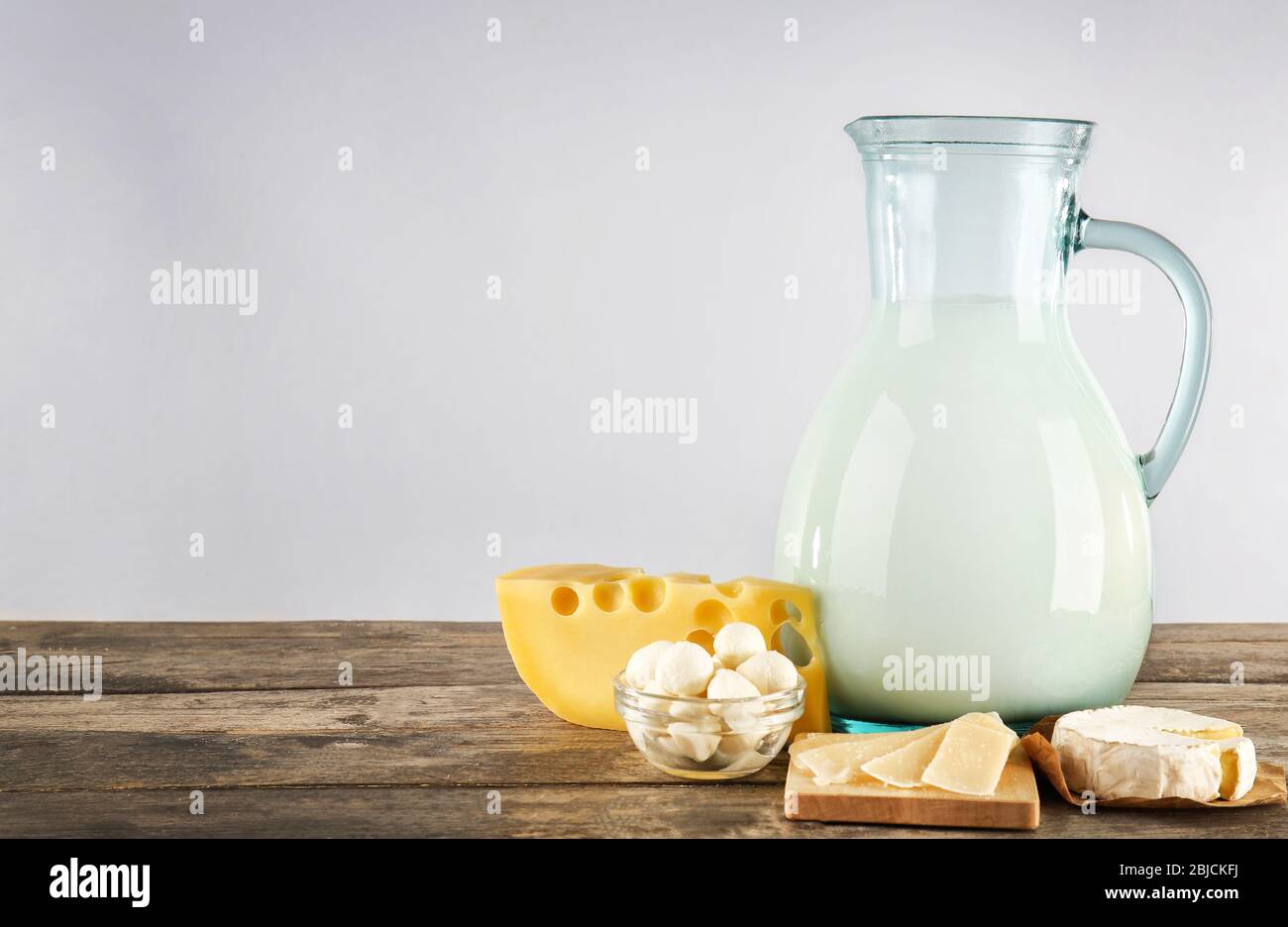 Dairy products on wooden table Stock Photo - Alamy